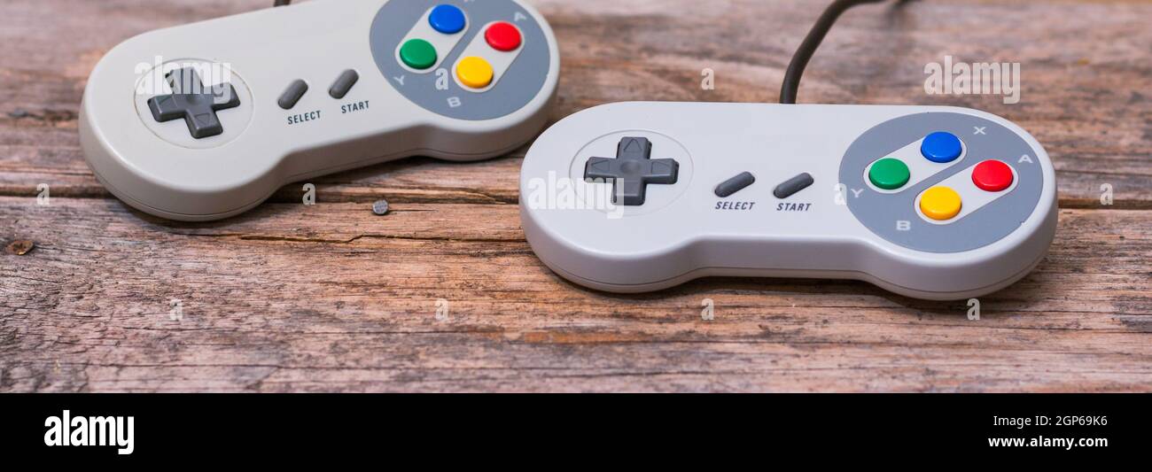 Retro computer gaming controller a rustic wooden background Stock Photo ...