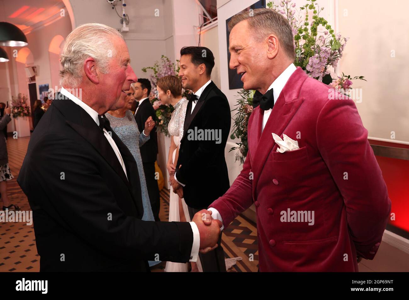 The Prince of Wales meets Daniel Craig upon his arrival for the World ...