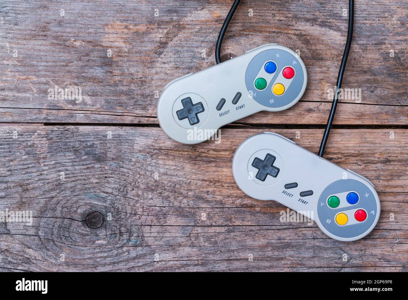 Retro computer gaming controller a rustic wooden background Stock Photo ...