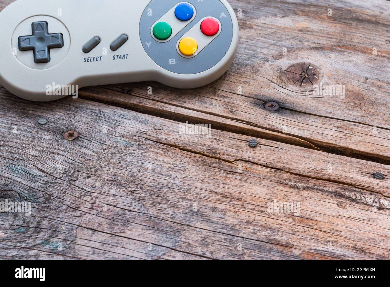 Retro computer gaming controller a rustic wooden background Stock Photo ...