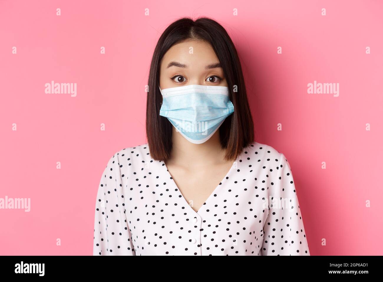 Covid-19, pandemic and lifestyle concept. Surprised asian woman in face ...