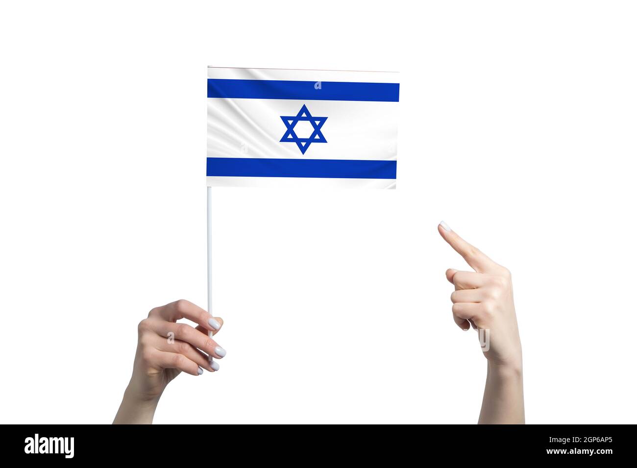 A beautiful female hand holds a Israel flag to which she shows the ...