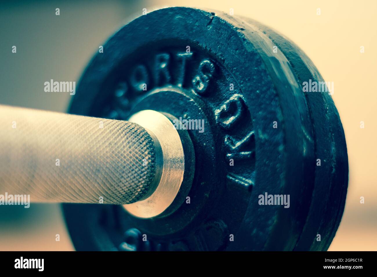 Black bar bell on the wooden floor, physical exercise Stock Photo - Alamy