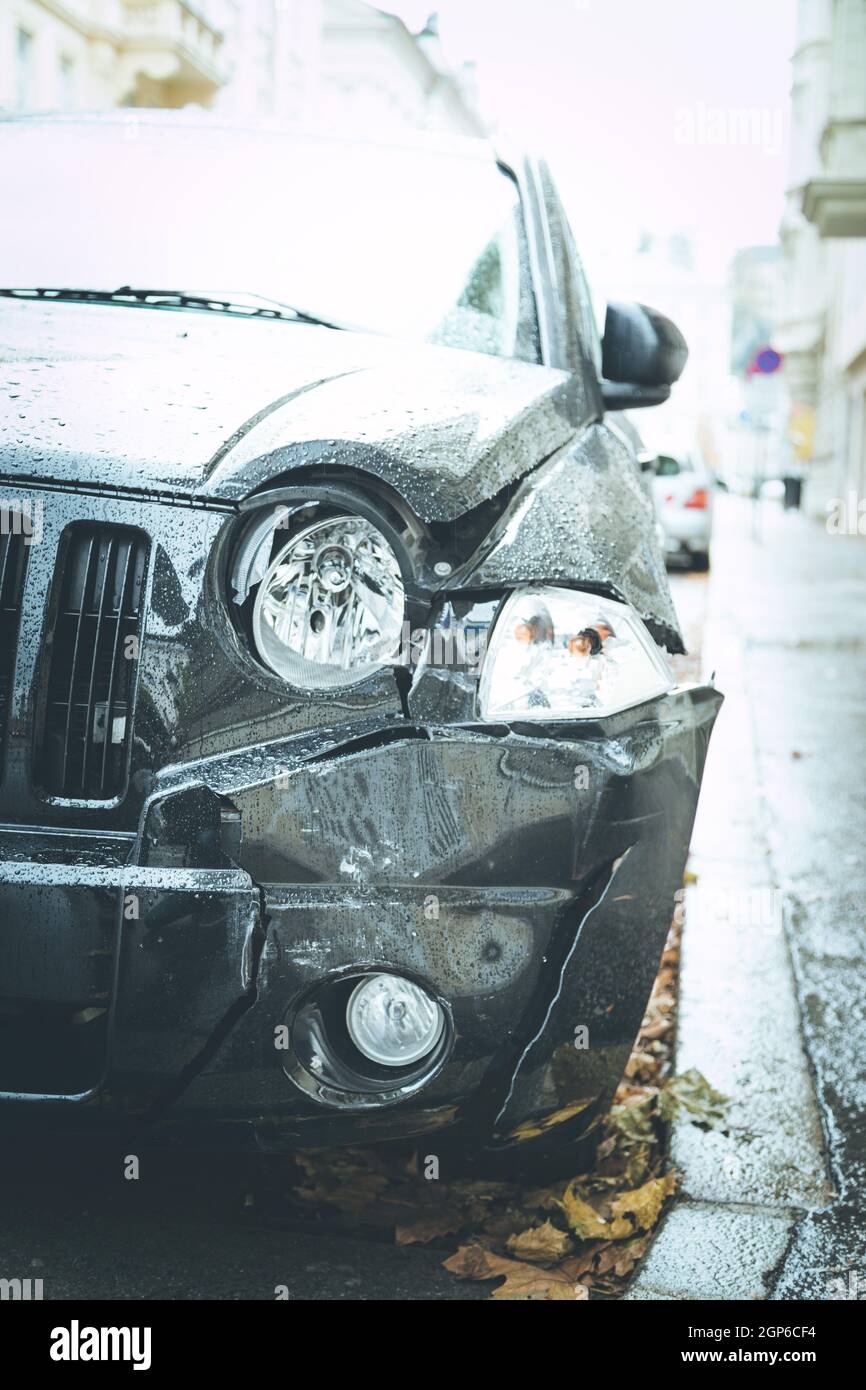 Close up of black damaged car, front view Stock Photo - Alamy