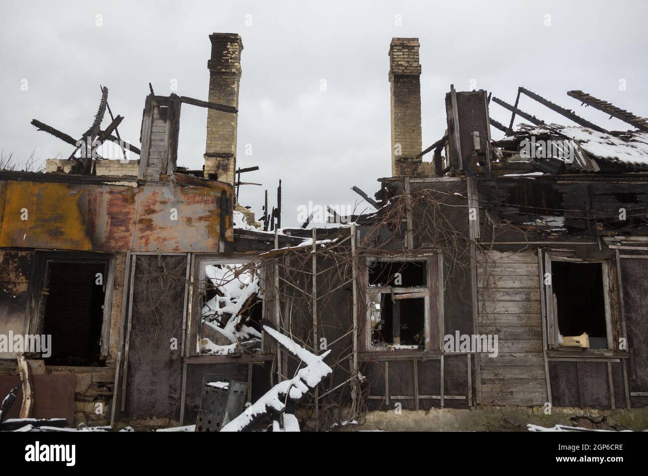 Burnt wooden house. House after the fire. House destroyed in a gas ...