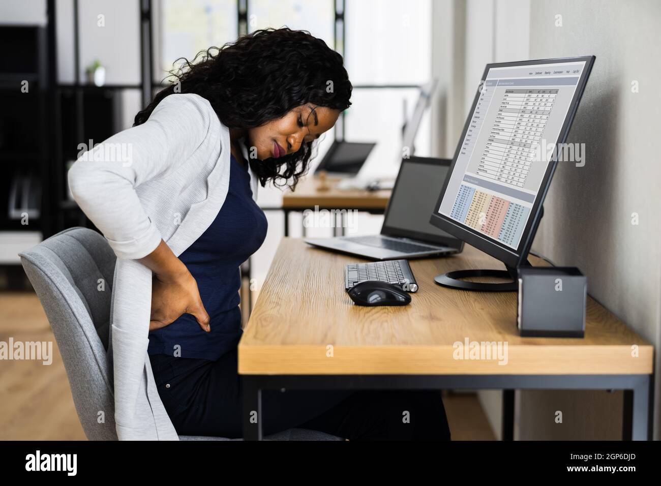 African Woman With Back Pain At Work Desk. Posture Problem Stock Photo ...