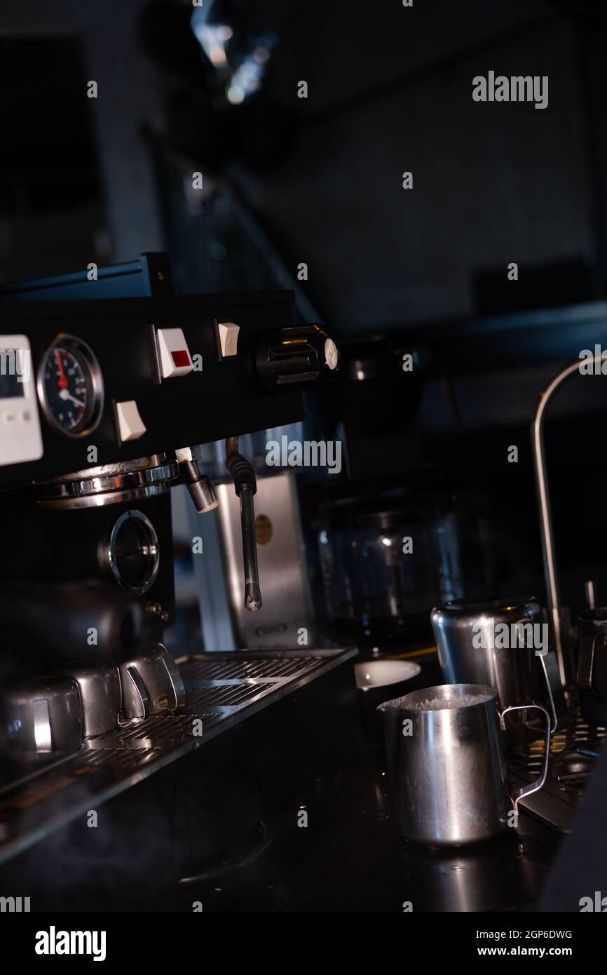 details of dark loft coffee shop. professional coffee machine close up ...