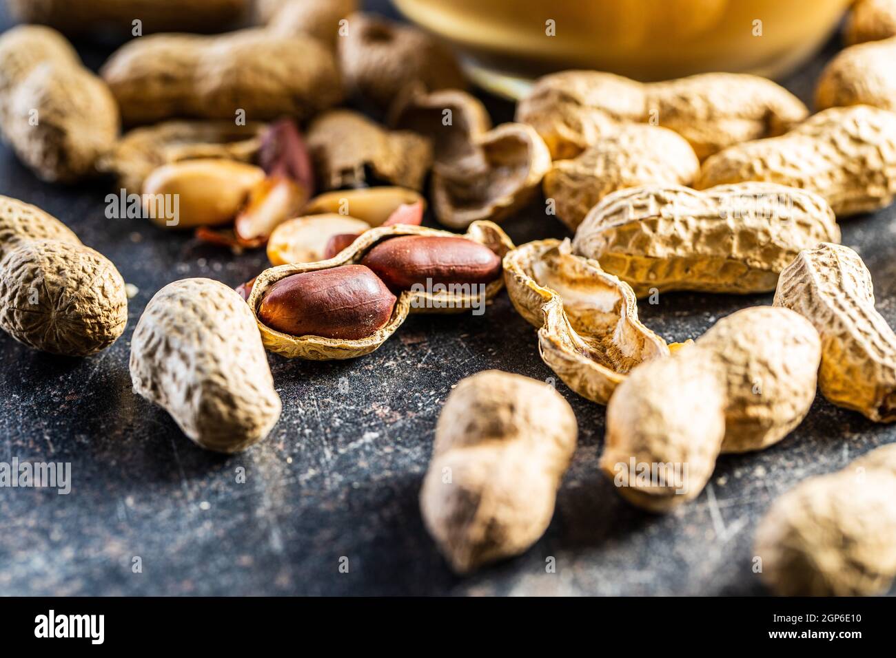 Roasted peanuts. Tasty groundnuts on black table Stock Photo - Alamy