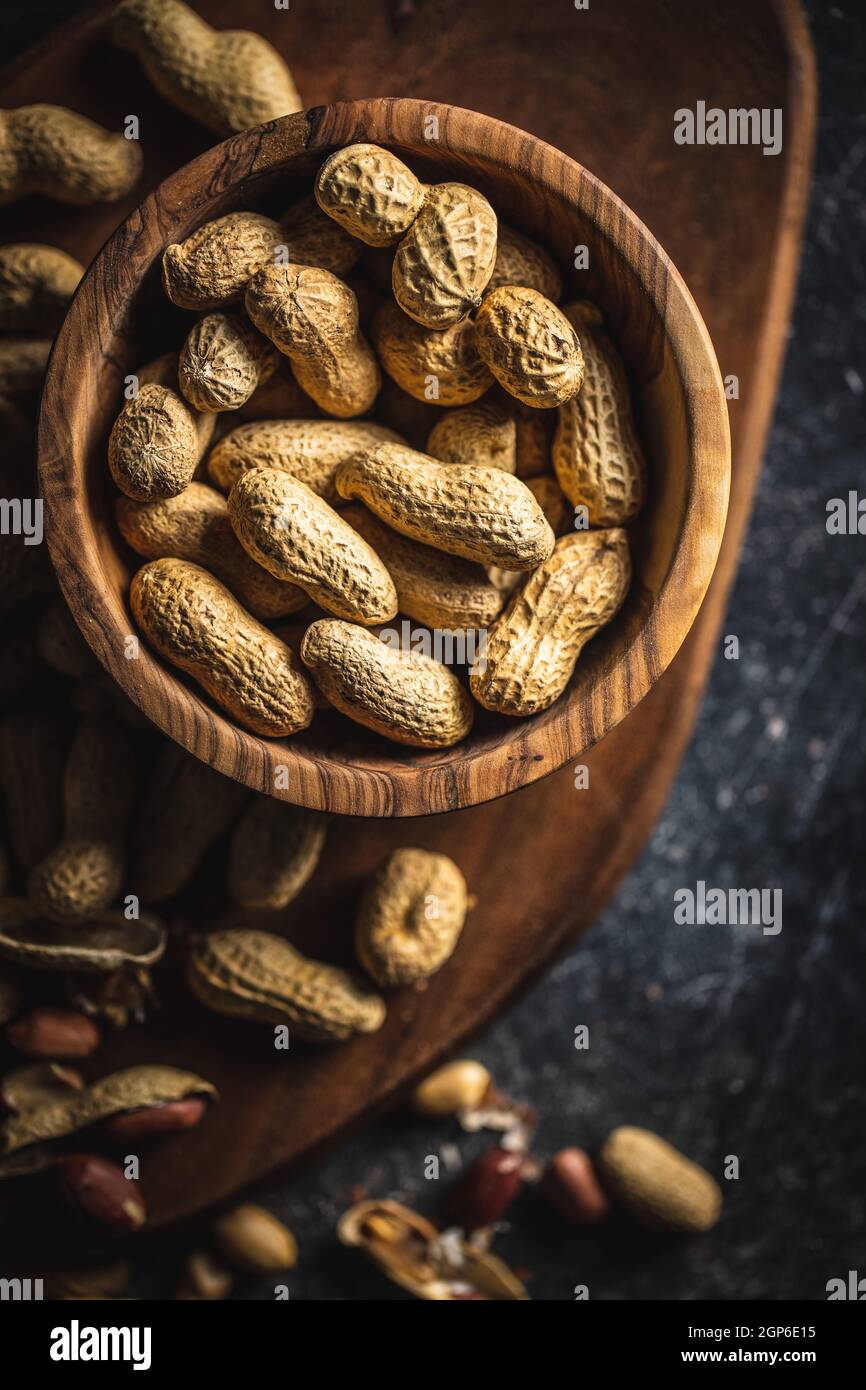 Roasted peanuts. Tasty groundnuts in a bowl. Top view Stock Photo - Alamy