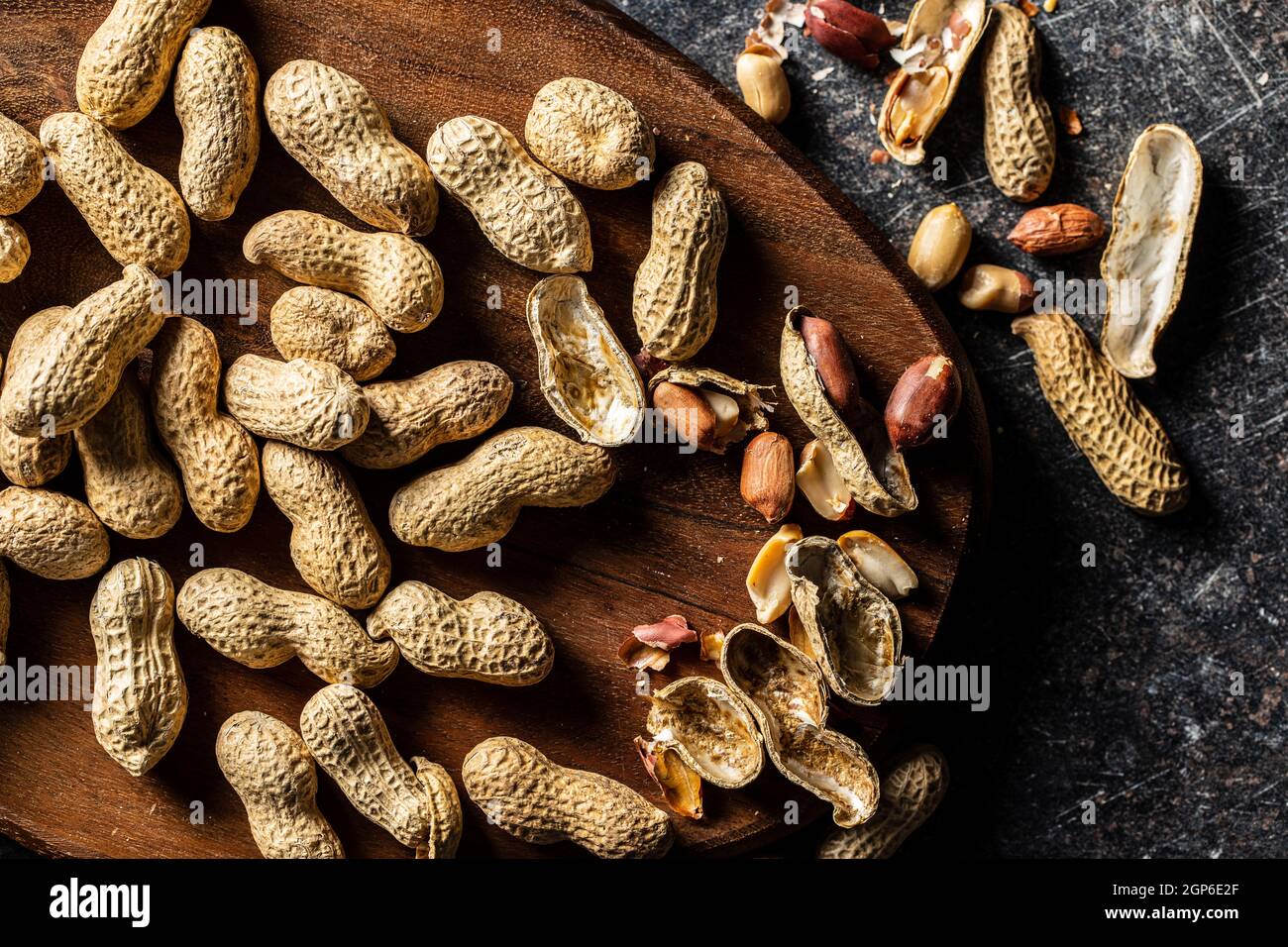 Roasted peanuts. Tasty groundnuts on cutting board. Top view Stock ...