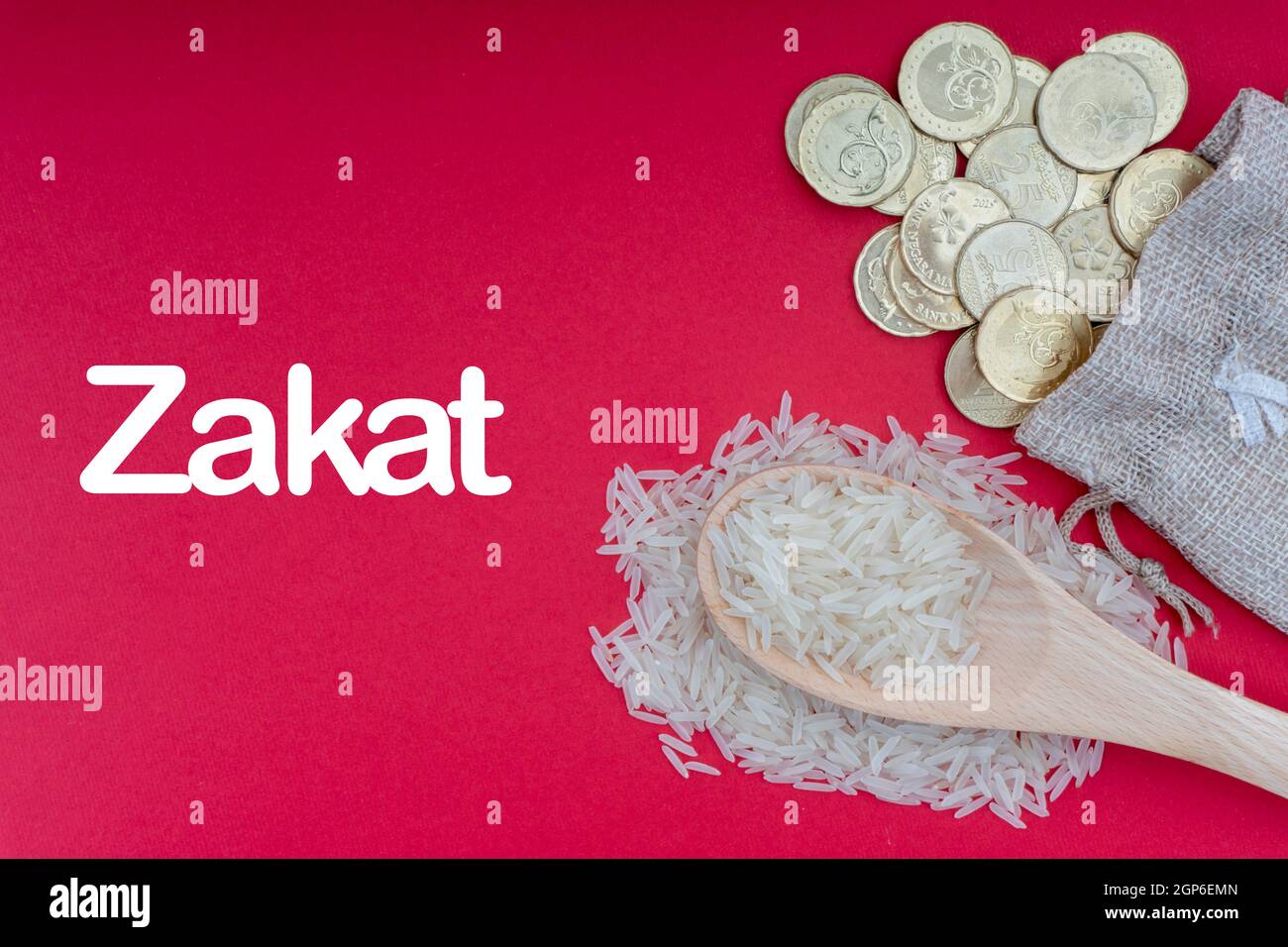 ZAKAT words with Coins and Rice on red background. Zakat concept. Zakat ...