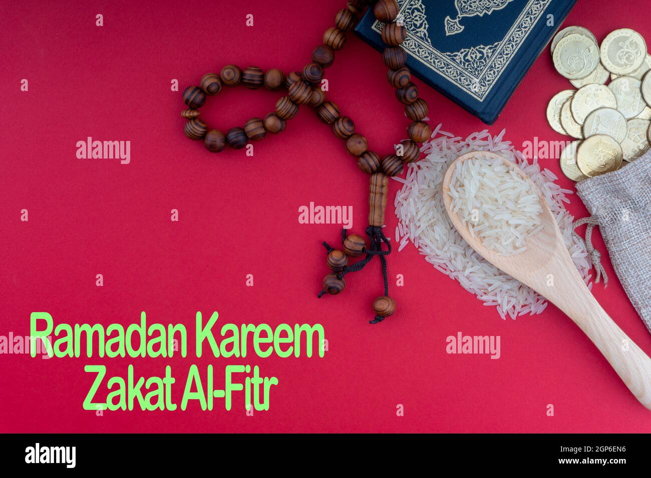 RAMADAN KAREEM ZAKAT AL FITR words with Holy Quran, Coins, Rosary and ...