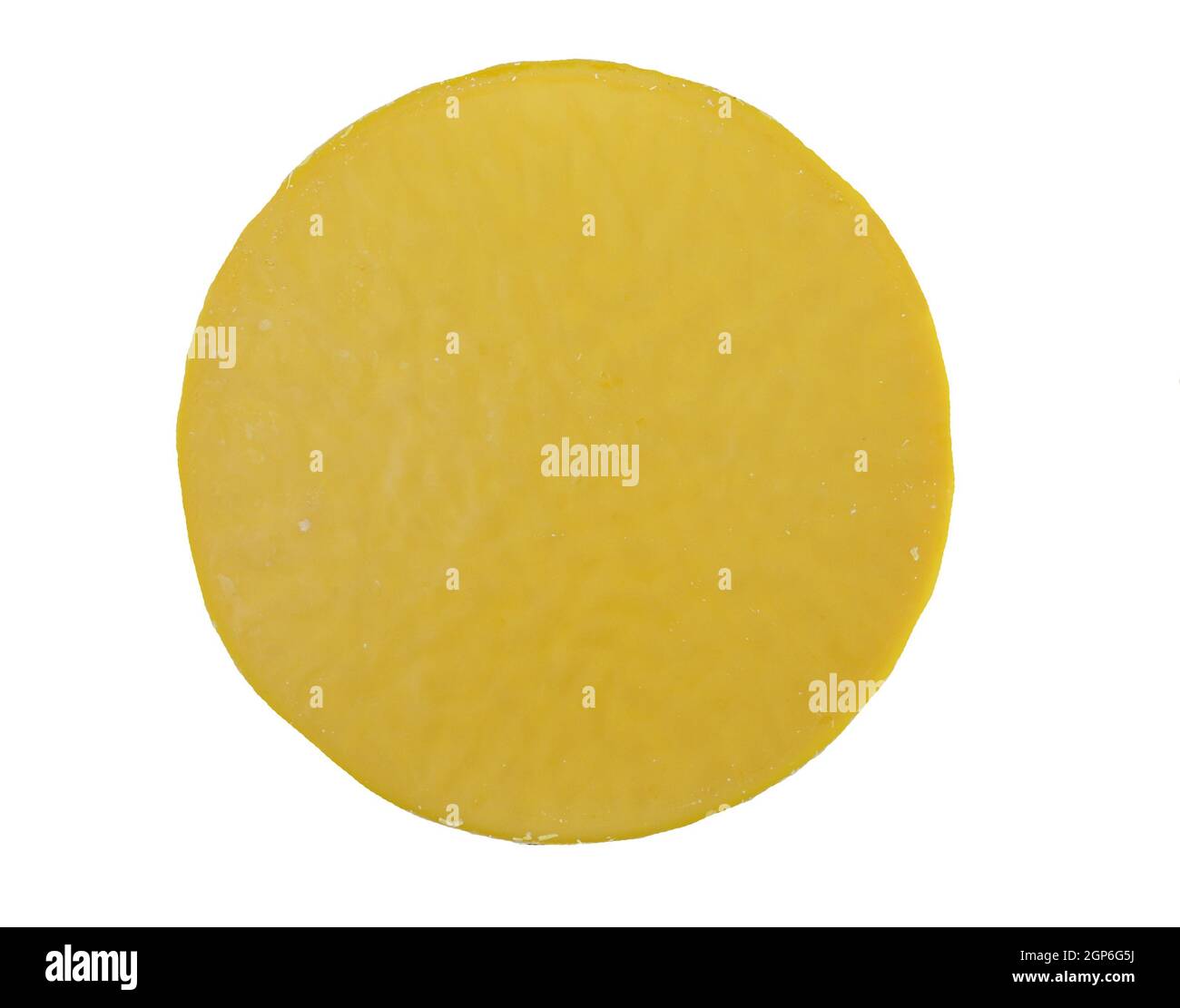 Round yellow wax block isolated Stock Photo - Alamy