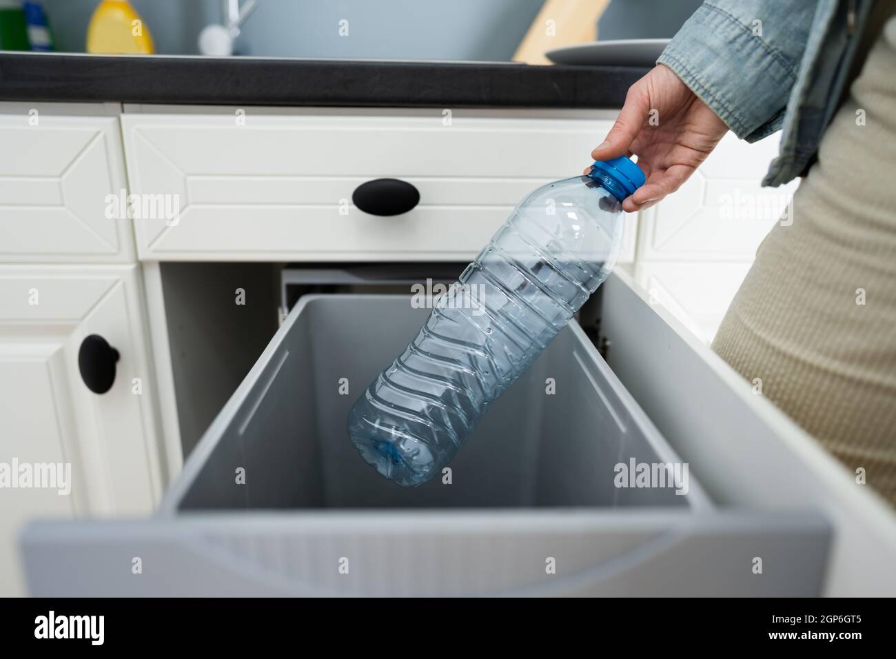 Bottle Recycle Bin In Kitchen. Plastic Garbage Sorting Stock Photo - Alamy