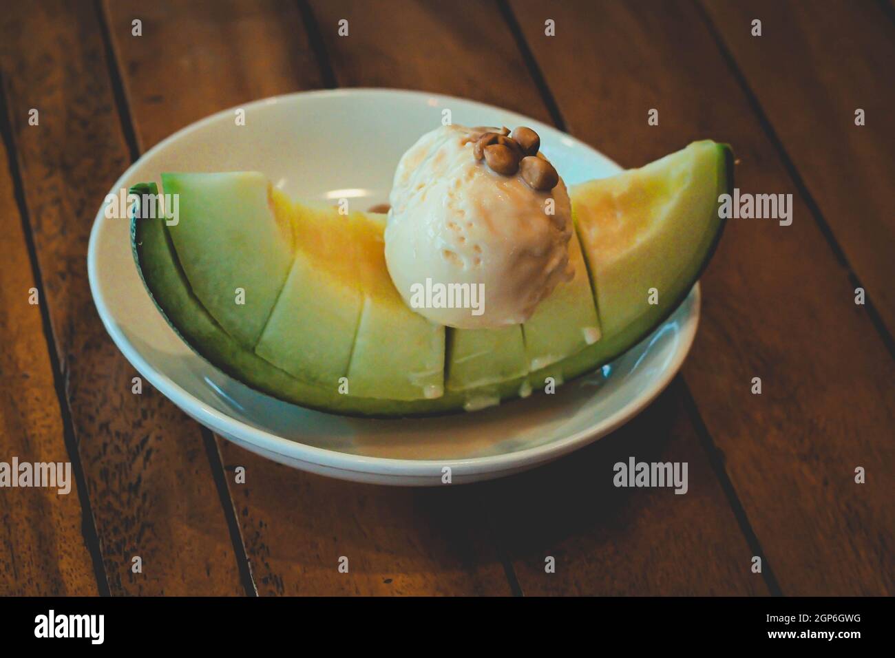 Fruity Melon dessert, topped with vanilla ice cream Stock Photo - Alamy