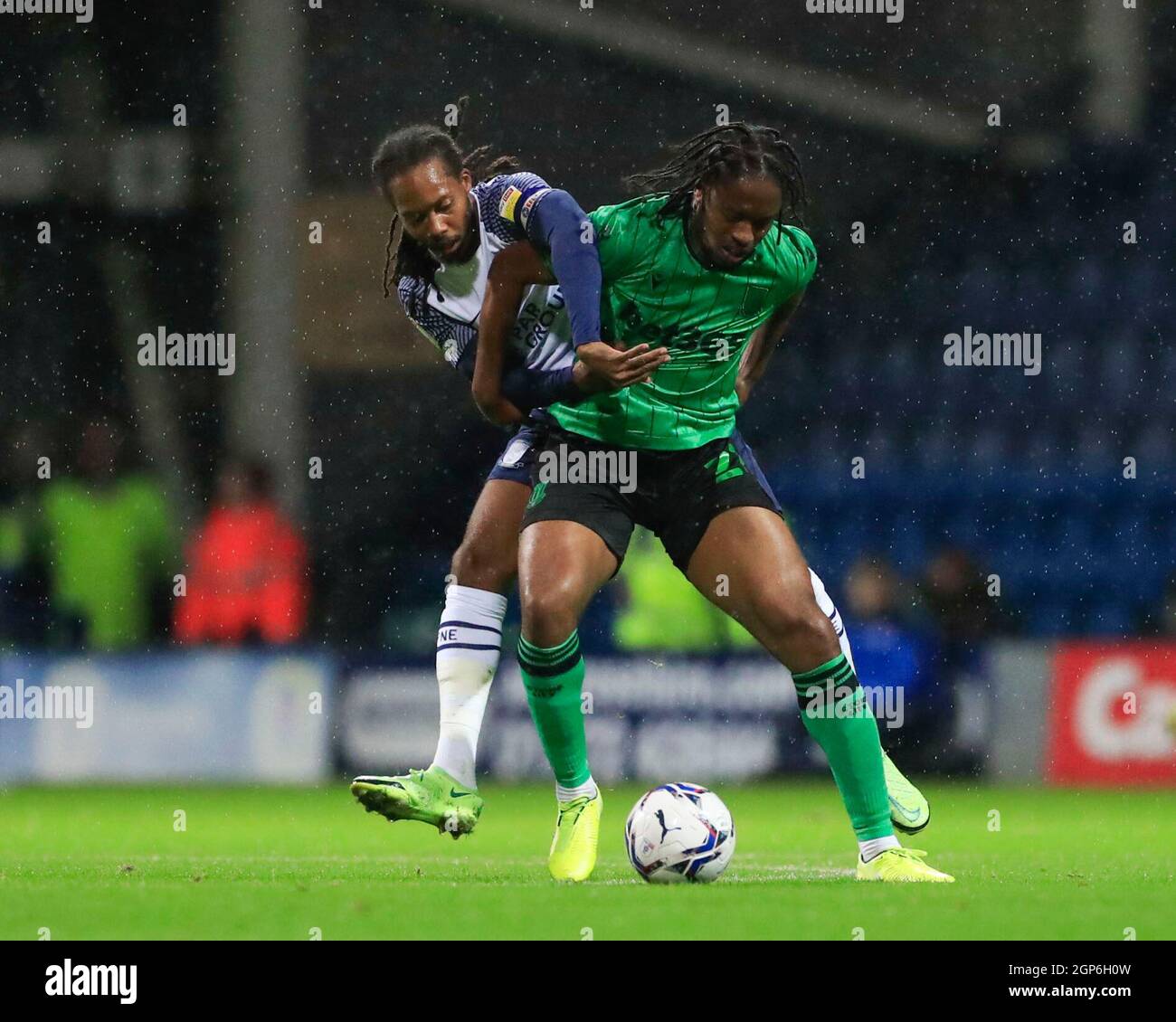Romaine Sawyers #28 of Stoke City shields the ball from Daniel Johnson ...