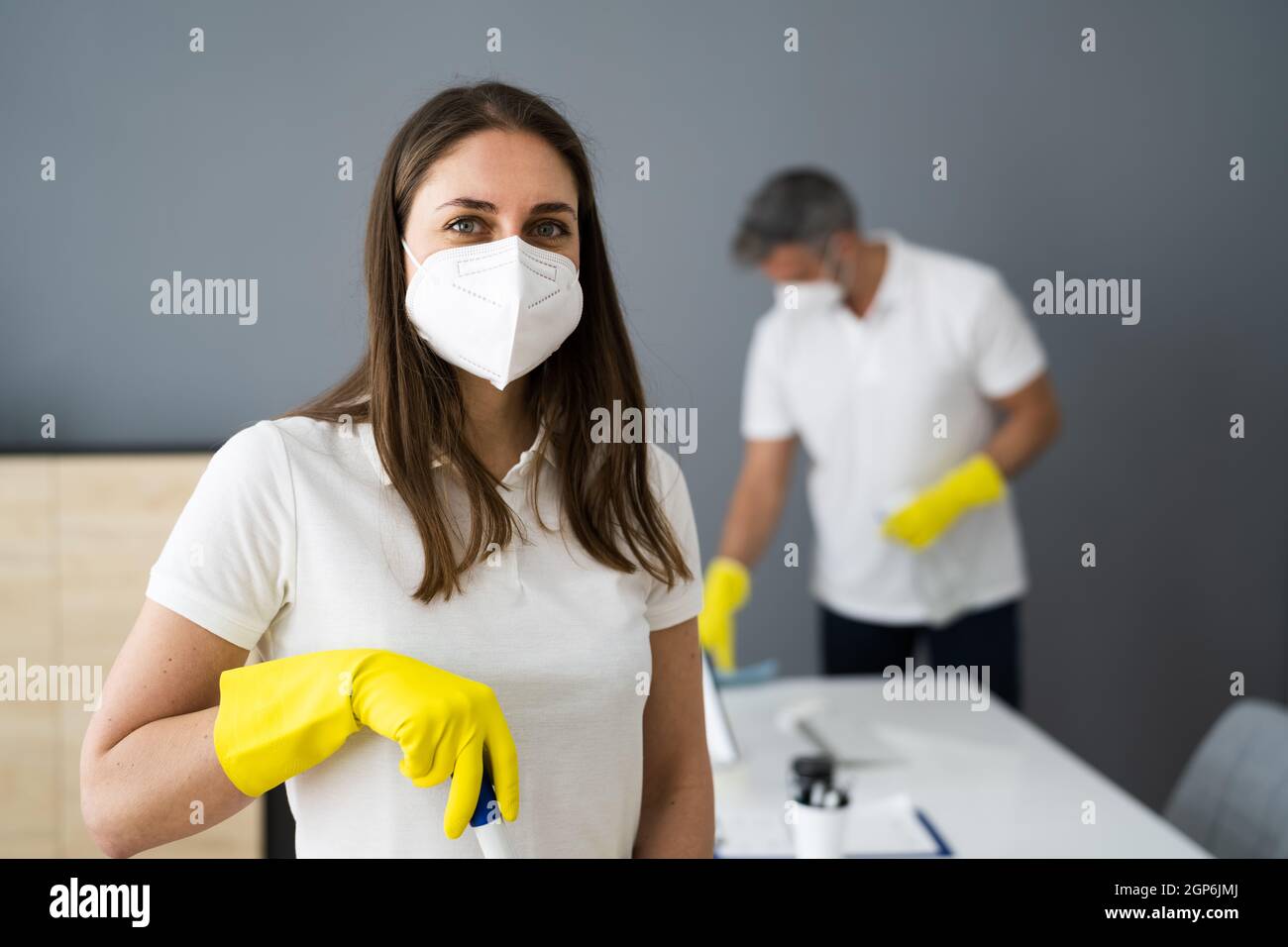 Cleaning Service Janitor Near Desk In Covid Face Mask Stock Photo - Alamy