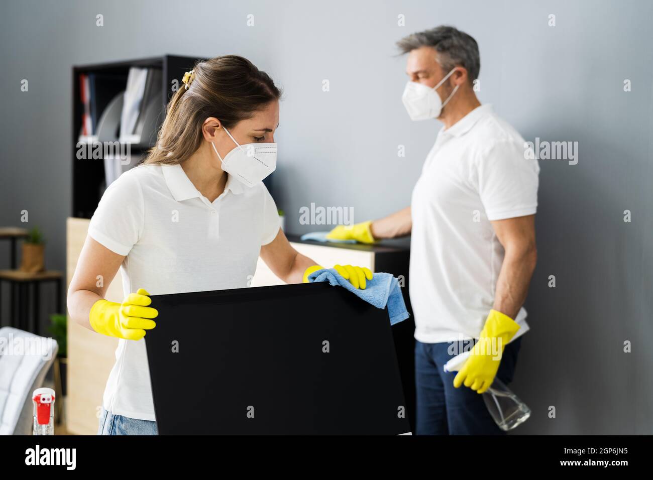 Janitor Service Woman Cleaning Monitor On Desk In Face Mask Stock Photo ...