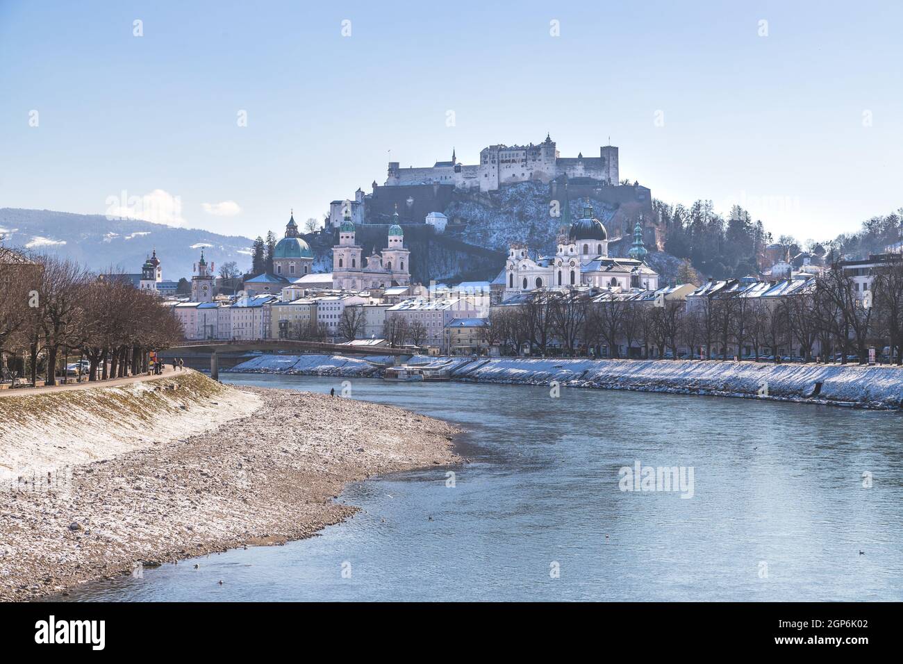 Panorama of Salzburg in winter, snow river bank, historical center ...