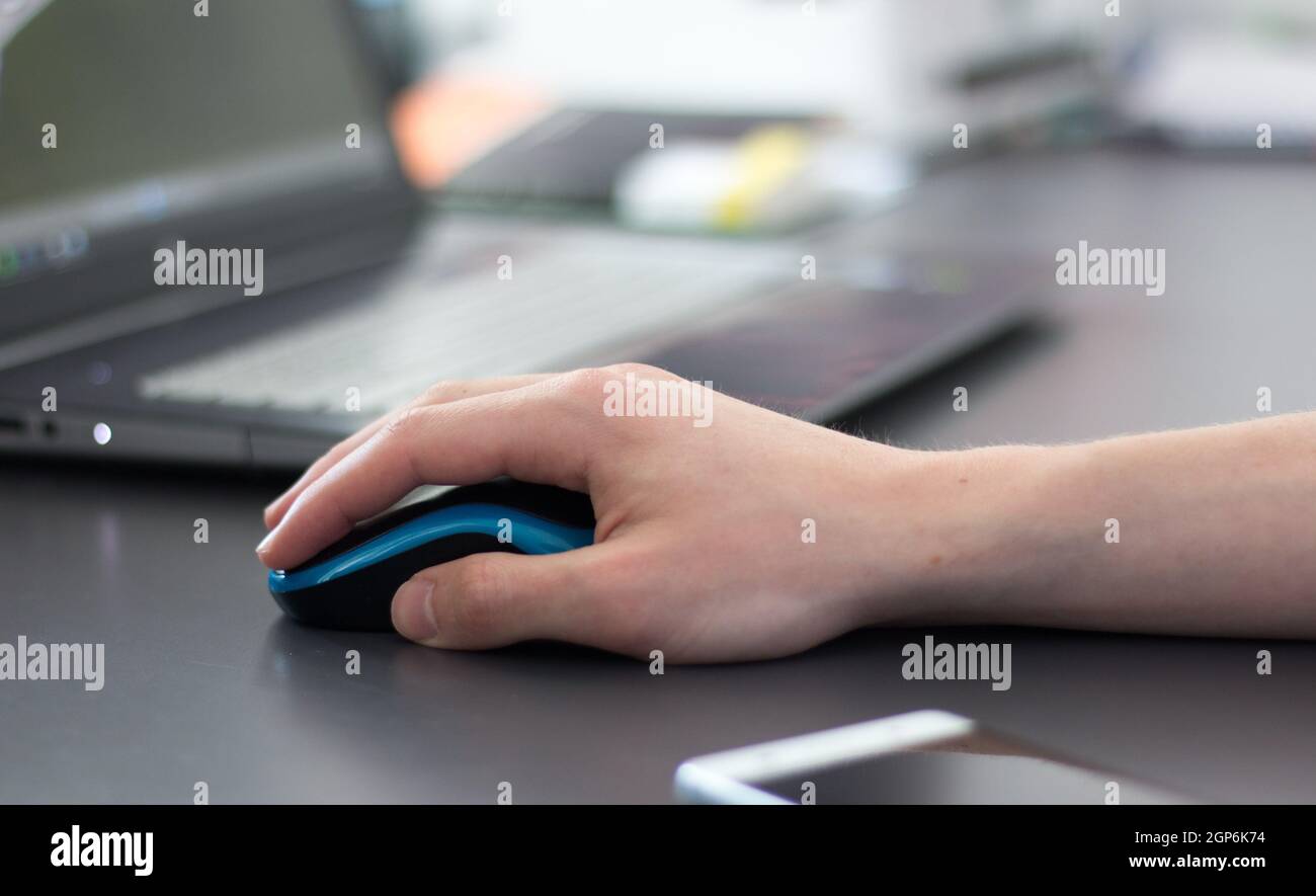 Close up of computer mouse used by a male hand Stock Photo - Alamy