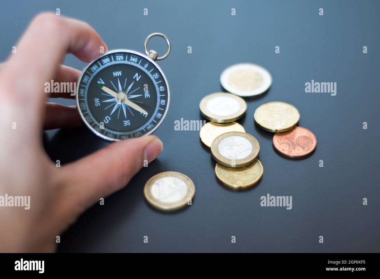 Closeup of a mans hand holding a compass in his hand. Concept for ...