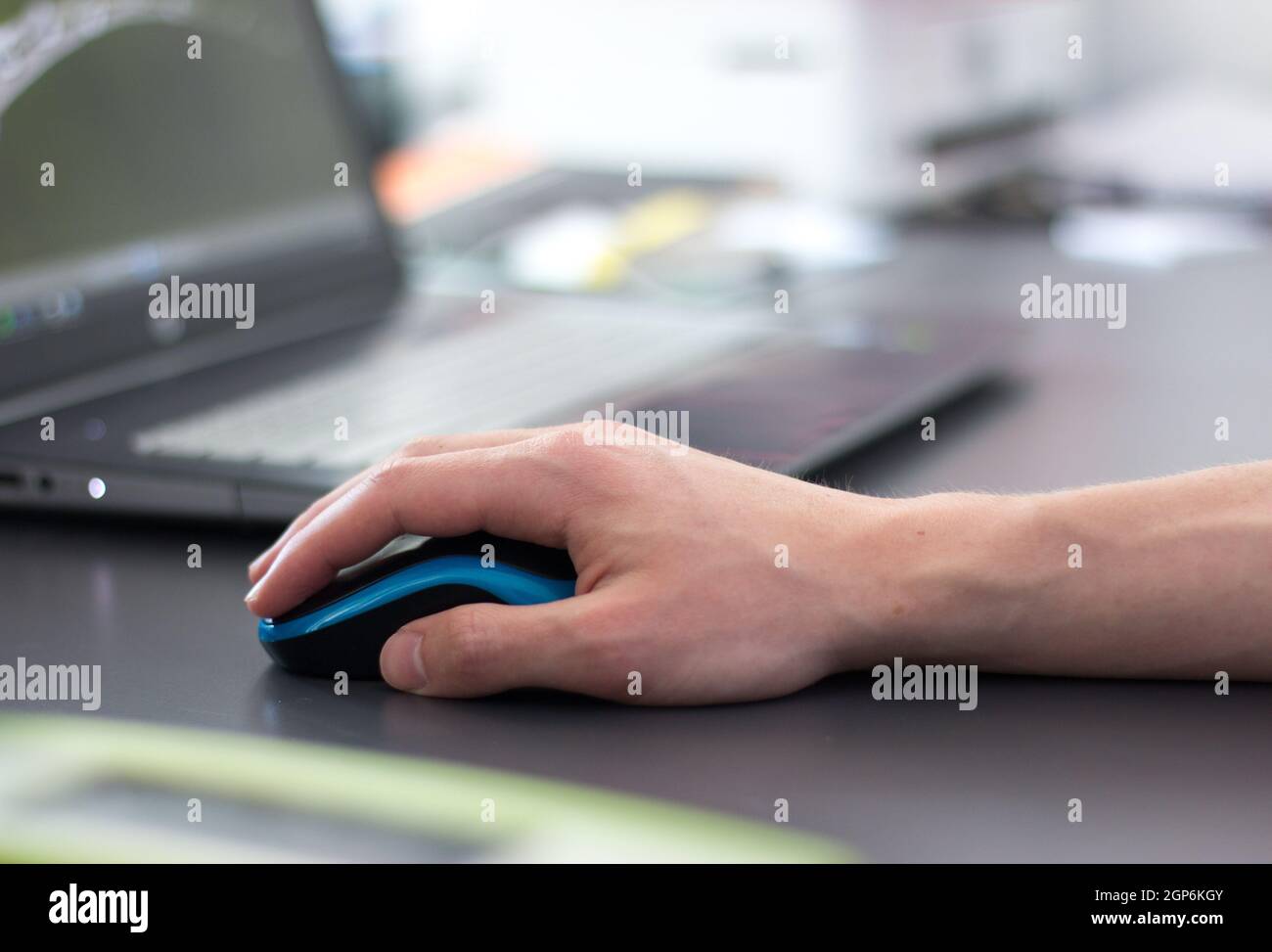 Close up of computer mouse used by a male hand Stock Photo - Alamy