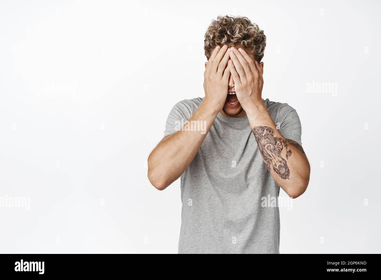 Embarrassed Guy Close His Eyes Covers Face With Hands And Screams From