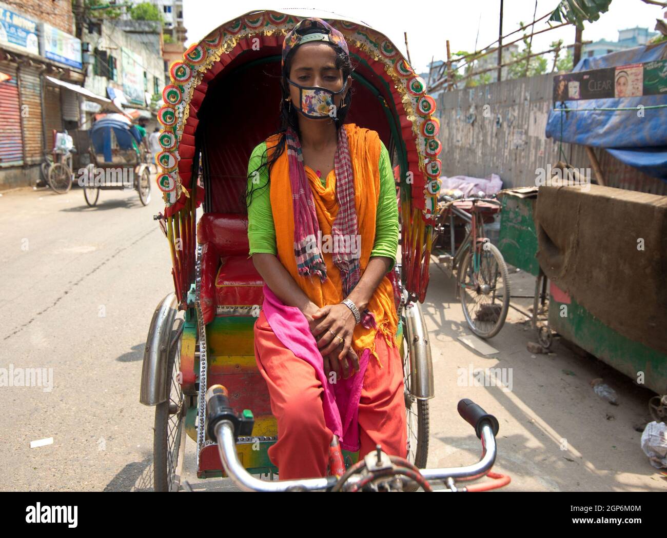 A female rickshaw rider. The country has had several lockdowns to ...