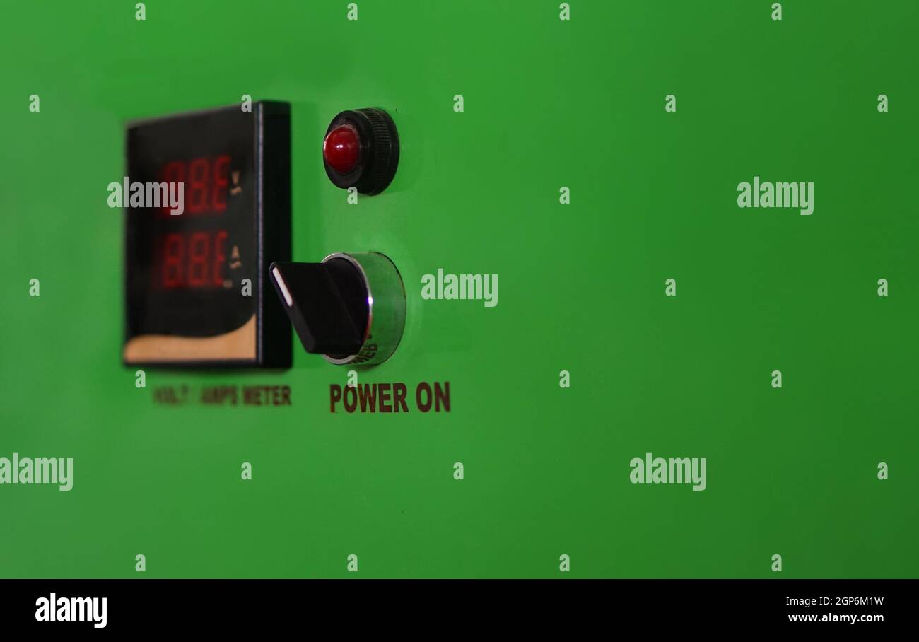 Close-up view of power on /off switch,lamp and digital meter on control ...