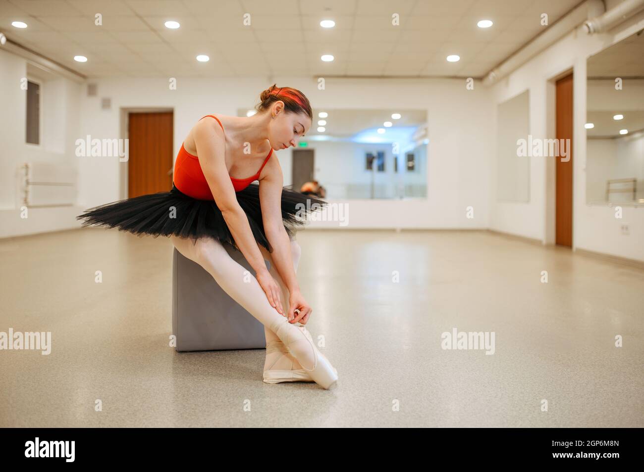 Choreographer leisures after lesson in class. Ballet school, female ...