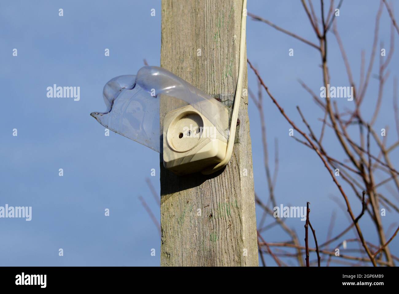 Homemade outlet protection from the rain. Location socket outdoors ...