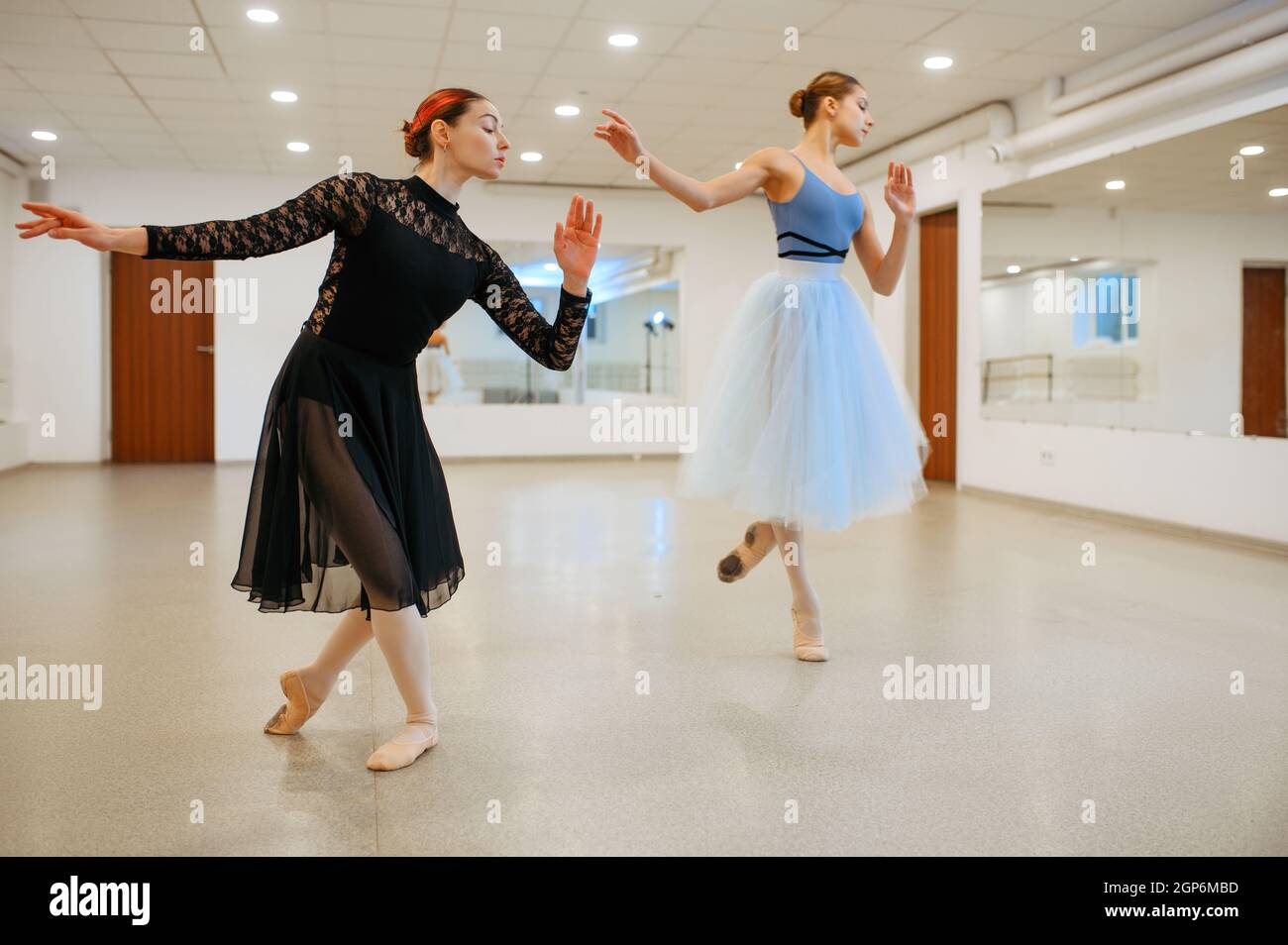 Choreographer works with young ballerina in class. Ballet school ...