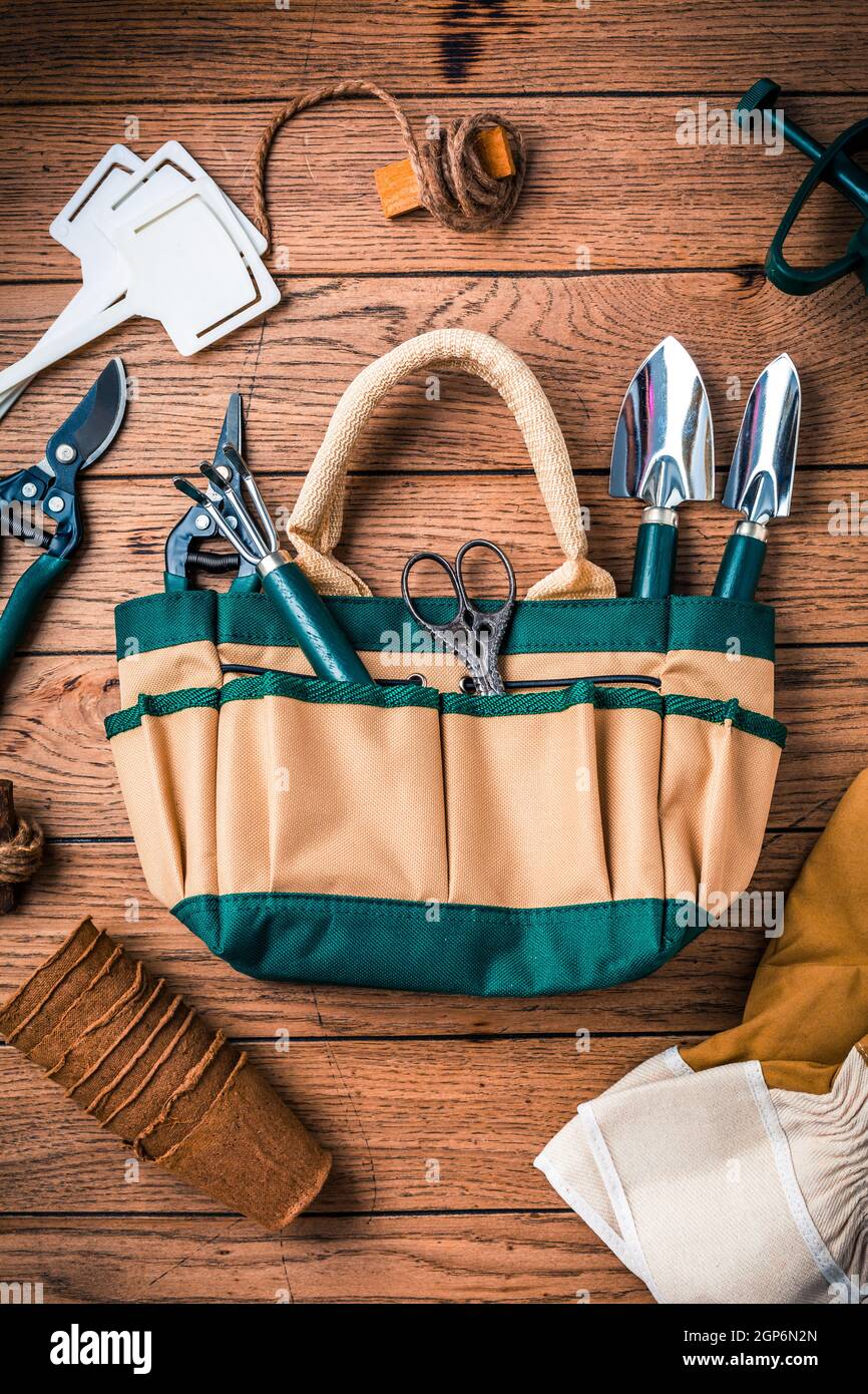 Gardening tools and equipment on wooden background Stock Photo - Alamy