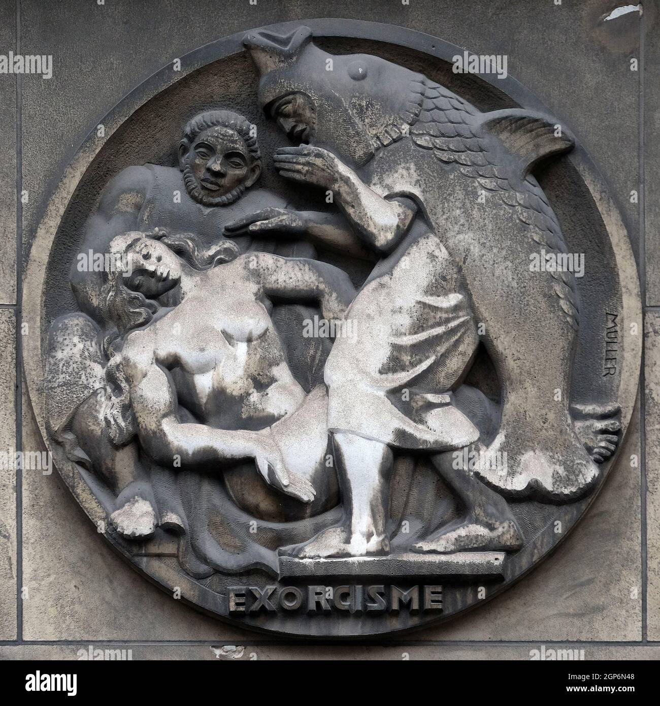 Exorcism. Stone relief at the building of the Faculte de Medicine Paris ...