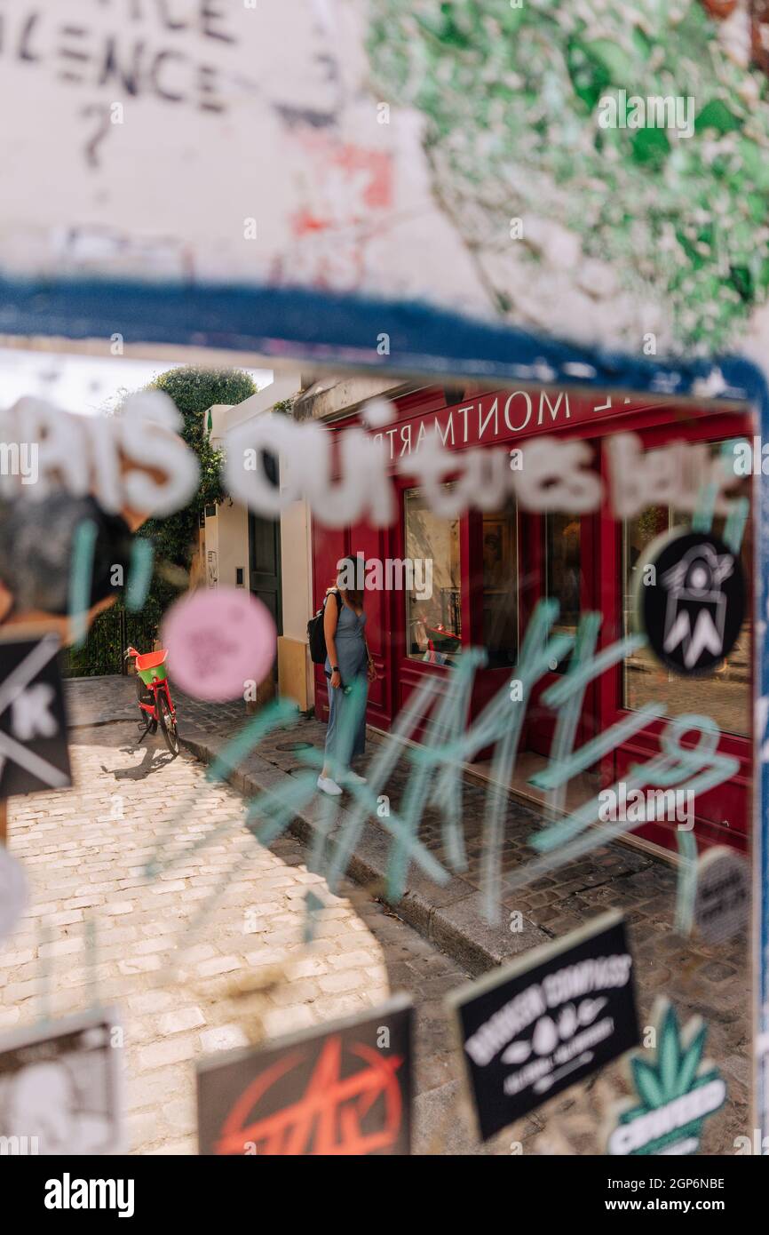Tourist through a mirror full of graffiti in Paris, France Stock Photo ...