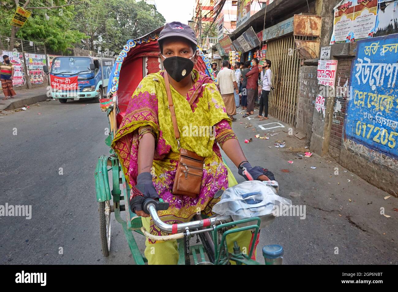 A female rickshaw rider. The country has had several lockdowns to ...