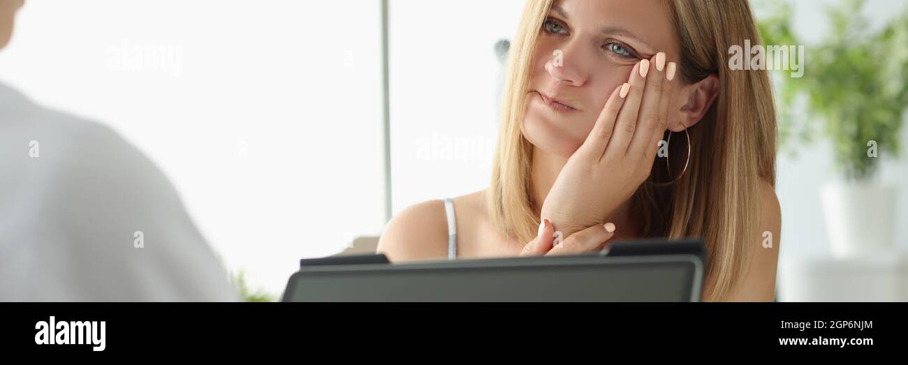 Female patient with acute toothache at doctor appointment with X-ray ...