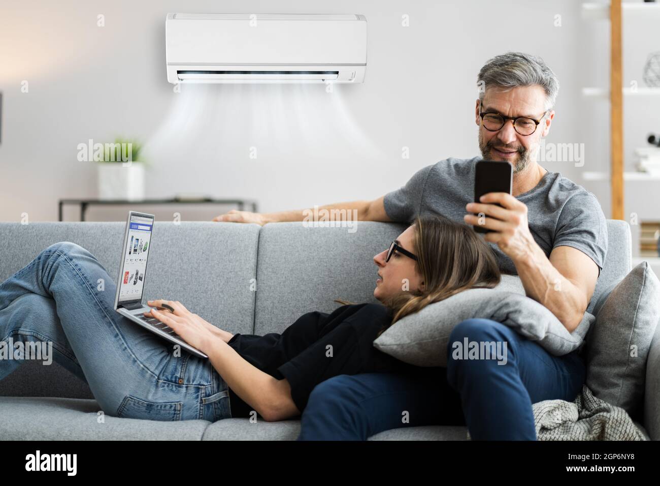 Happy Family Using Air Condition In House Stock Photo - Alamy