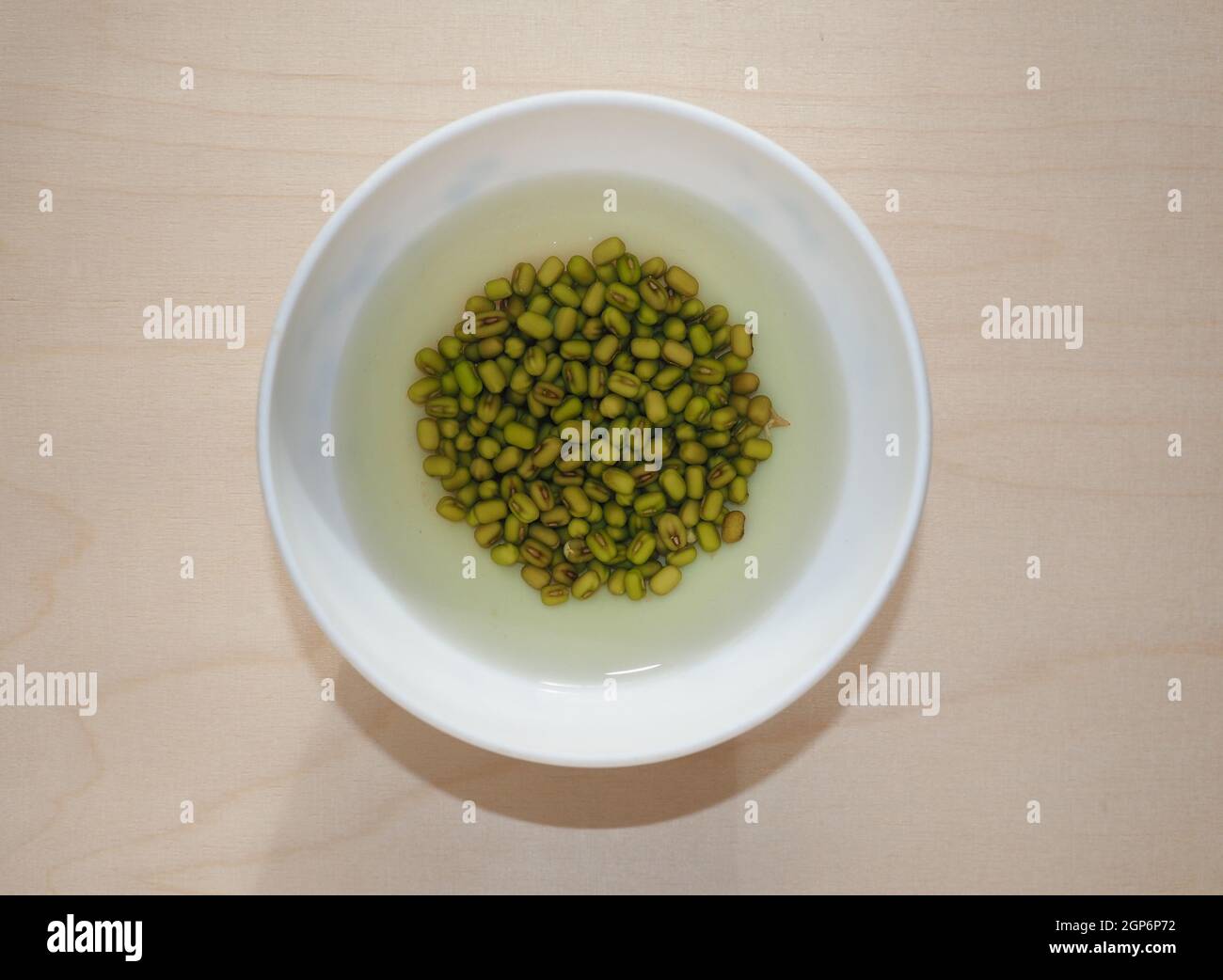 dried adzuki beans in a bowl with water Stock Photo - Alamy