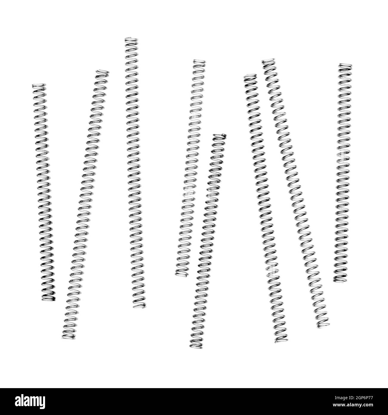 many metal springs isolated over white background Stock Photo - Alamy