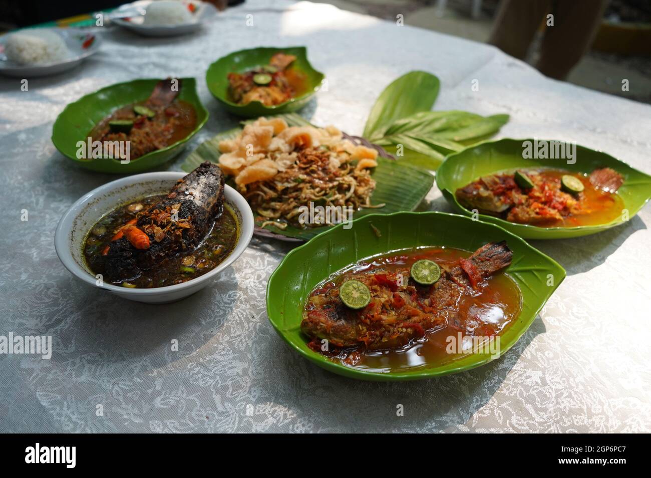 Tasty Escabeche fish topped with vegetables and Mie Goreng stir fried ...