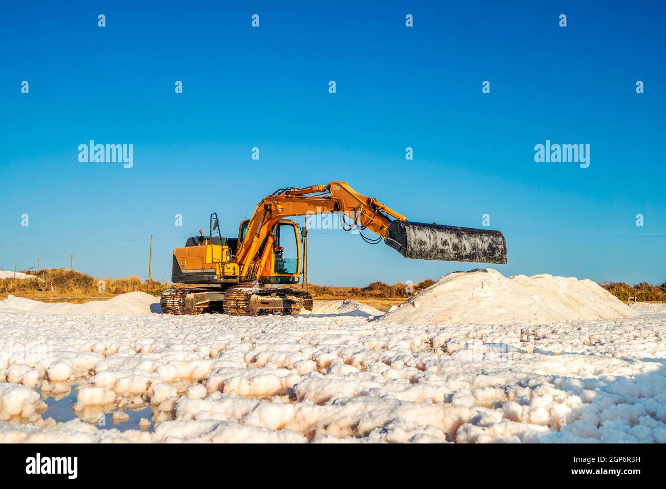 Excavator harvesting sea salt, aline, Faro, Algarve, Portugal Stock ...