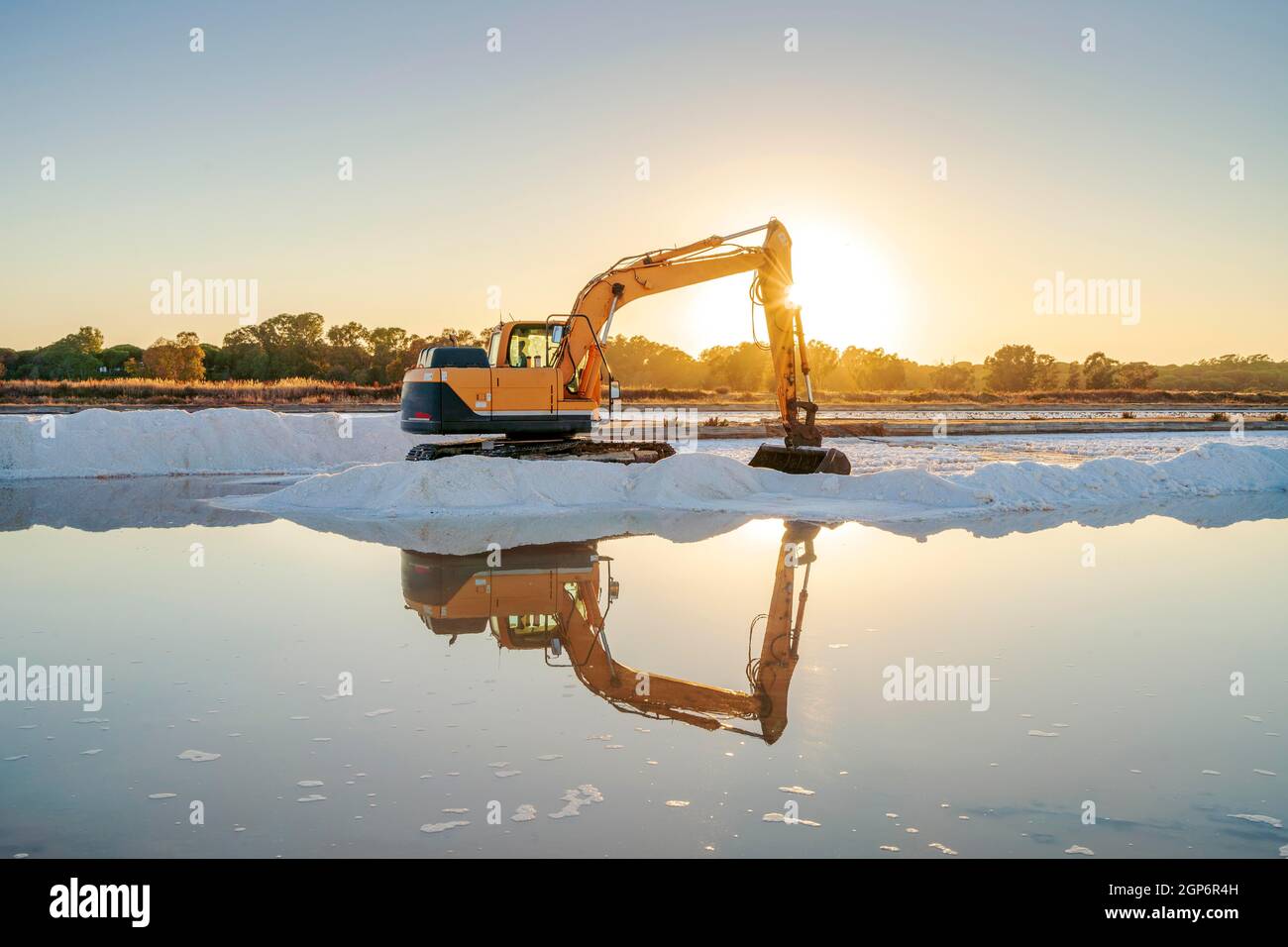 Excavator harvesting sea salt, salt works, Faro, Algarve, Portugal ...