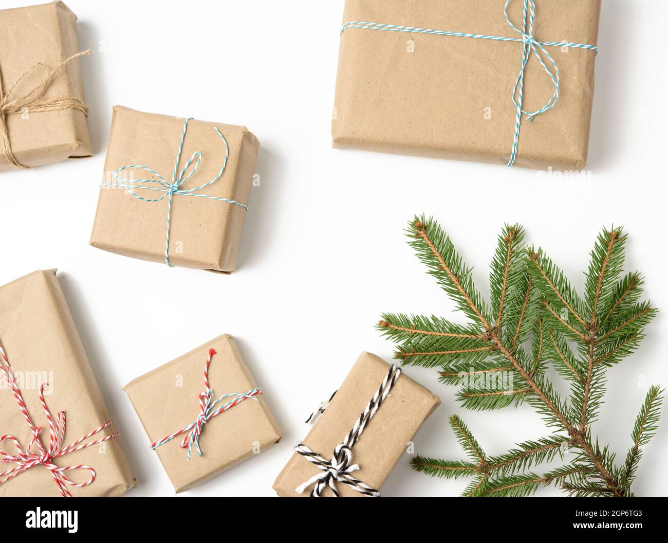 box wrapped in brown kraft paper and tied with rope, gift on white ...