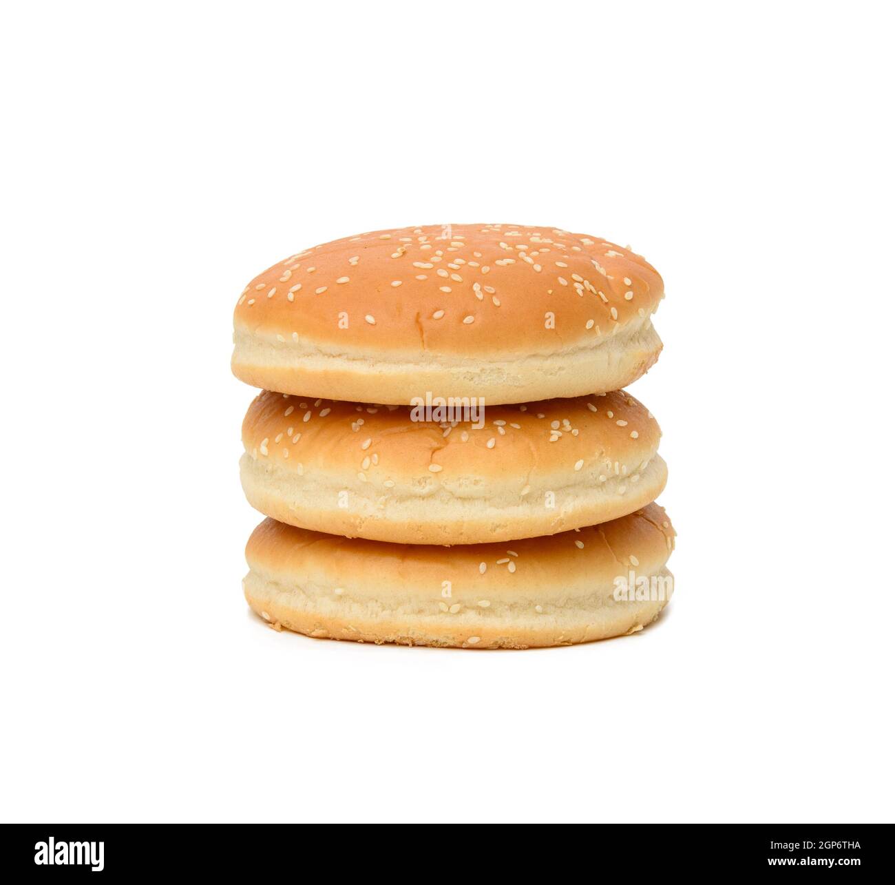 stack of baked round burger buns isolated on white background, close up ...