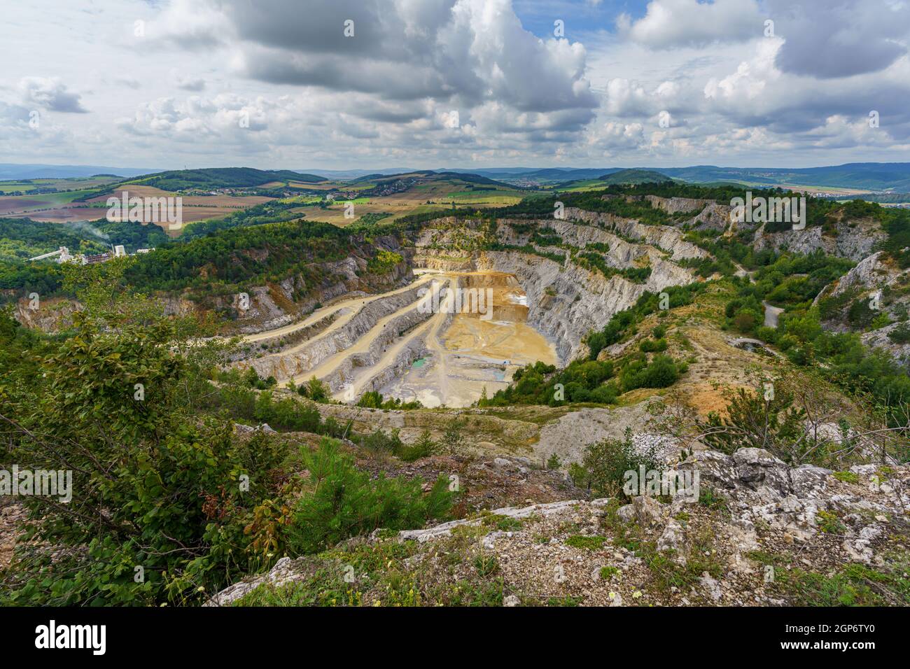 Surface limestone mine with terraced stairs for material removal in ...