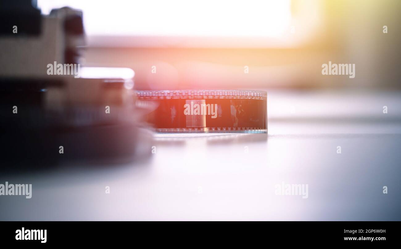 Filmstrip or film reel on a cutting table, vintage film production in ...