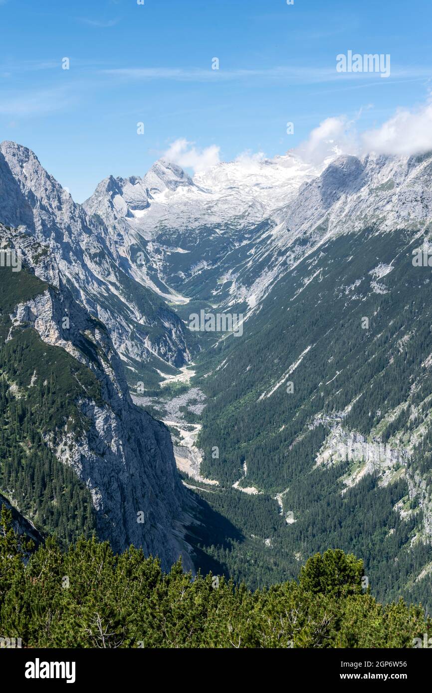 View into the Reintal valley, behind summit of the Zugspitze with ...