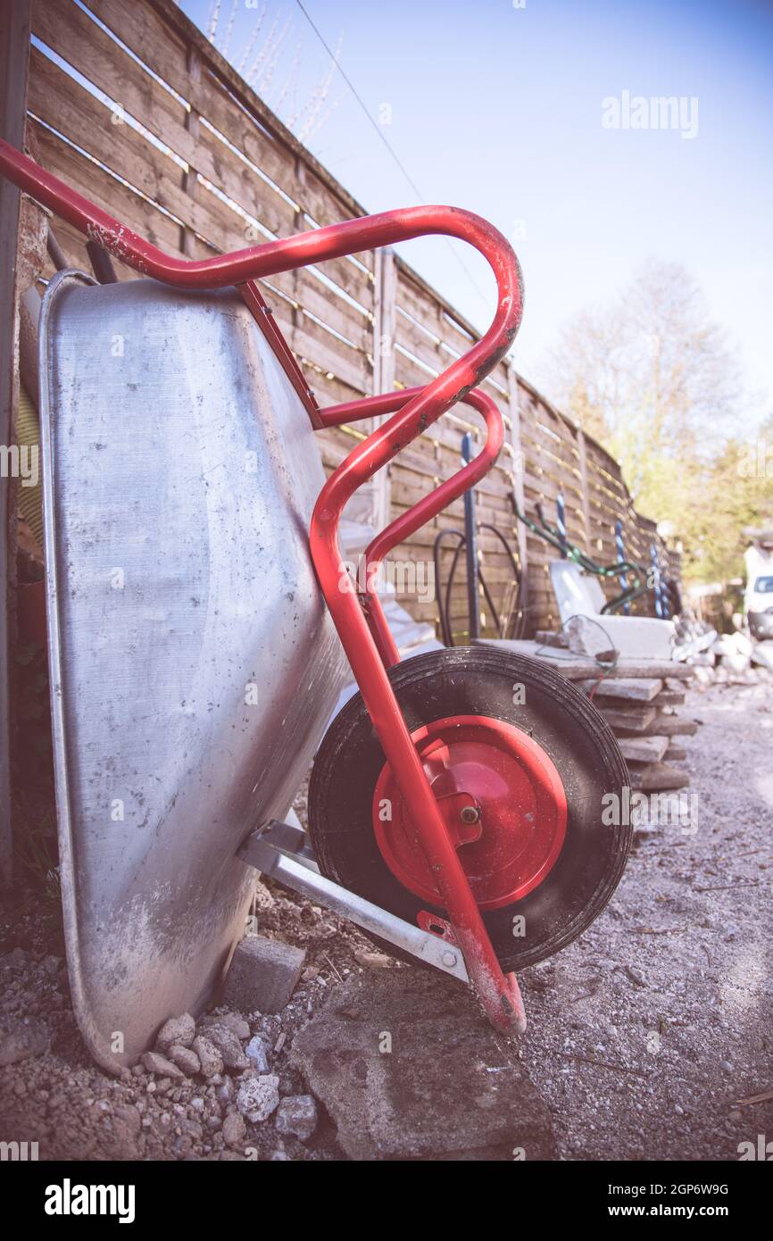 Wheelbarrow on a construction site, outdoors. Concept for renovation ...