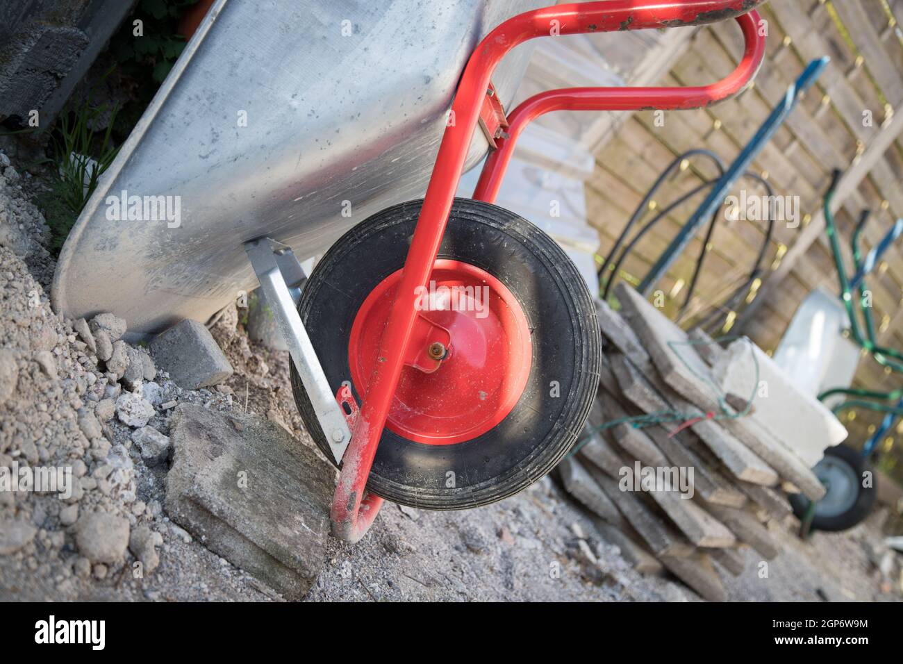 Wheelbarrow on a construction site, outdoors. Concept for renovation ...